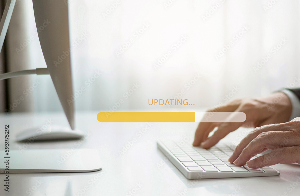 Businessman using desktop loading data with loading bar icon over a ...