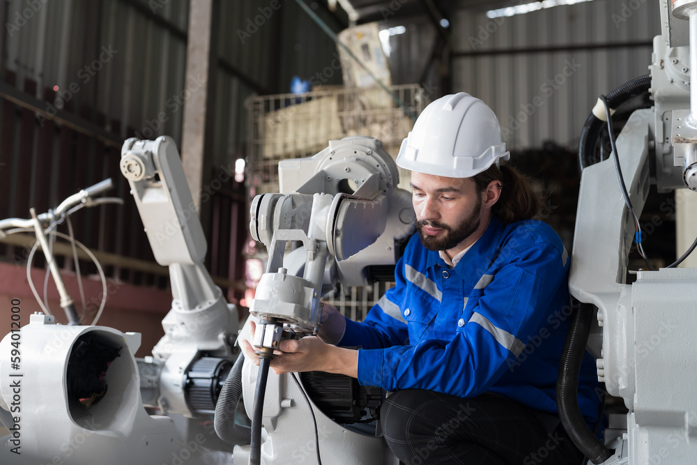 Industrial Robotic Arms. Automated manufacturing industries. Male ...