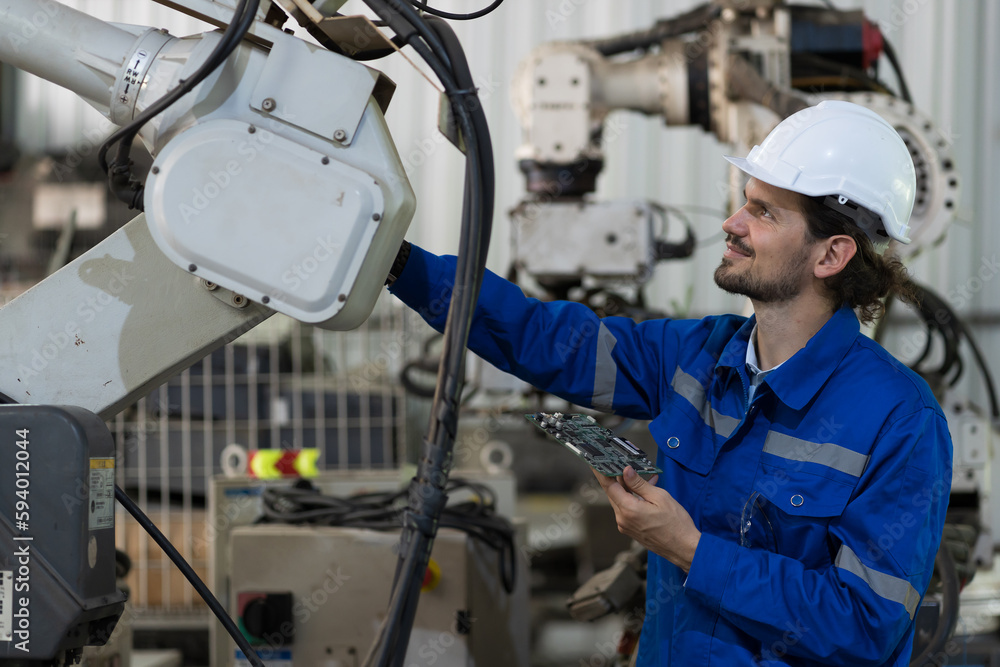 Industrial Robotic Arms. Automated manufacturing industries. Male ...