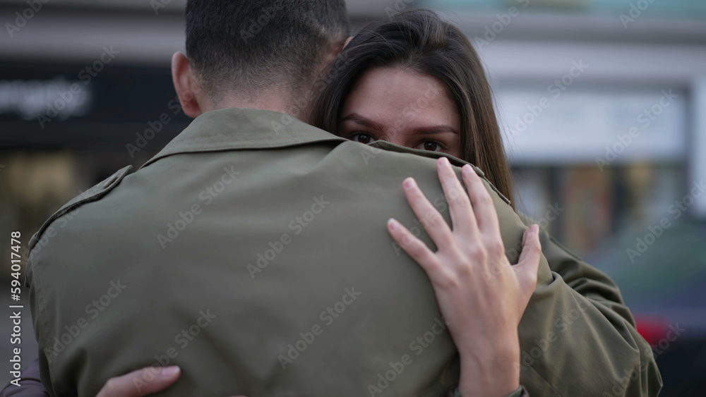 Couple embrace standing in street in empathic hug. Caring and ...