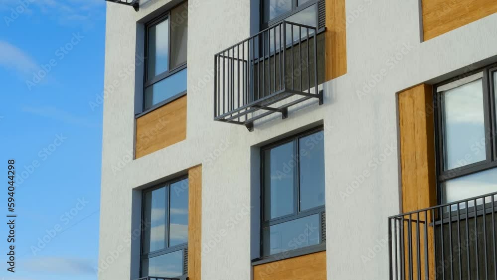Wall of modern apartment building. The facade of the building in white ...