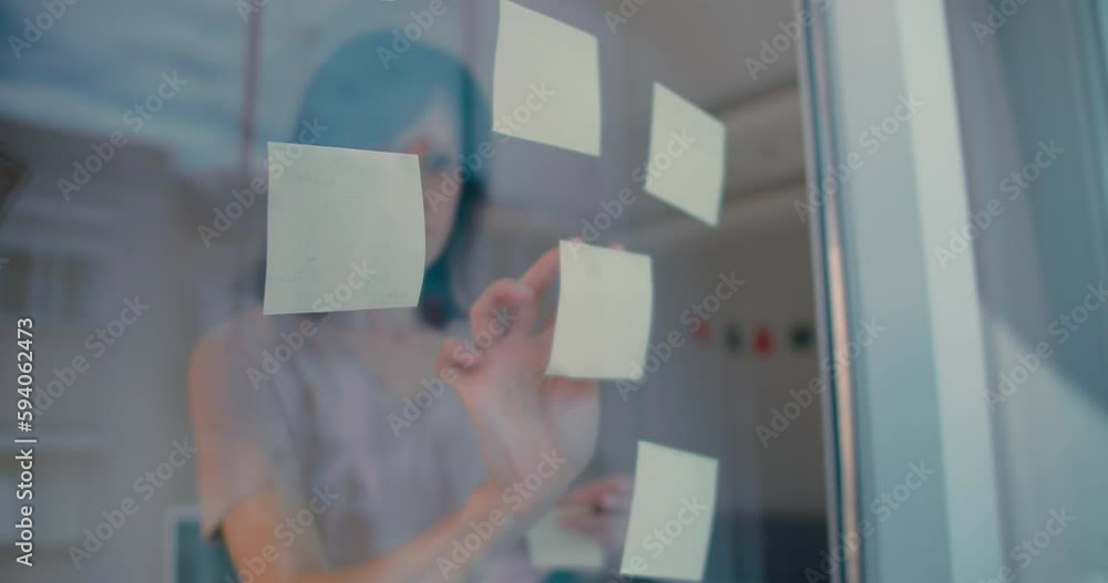 Woman using sticky notes brainstorming ideas problem solving with ...