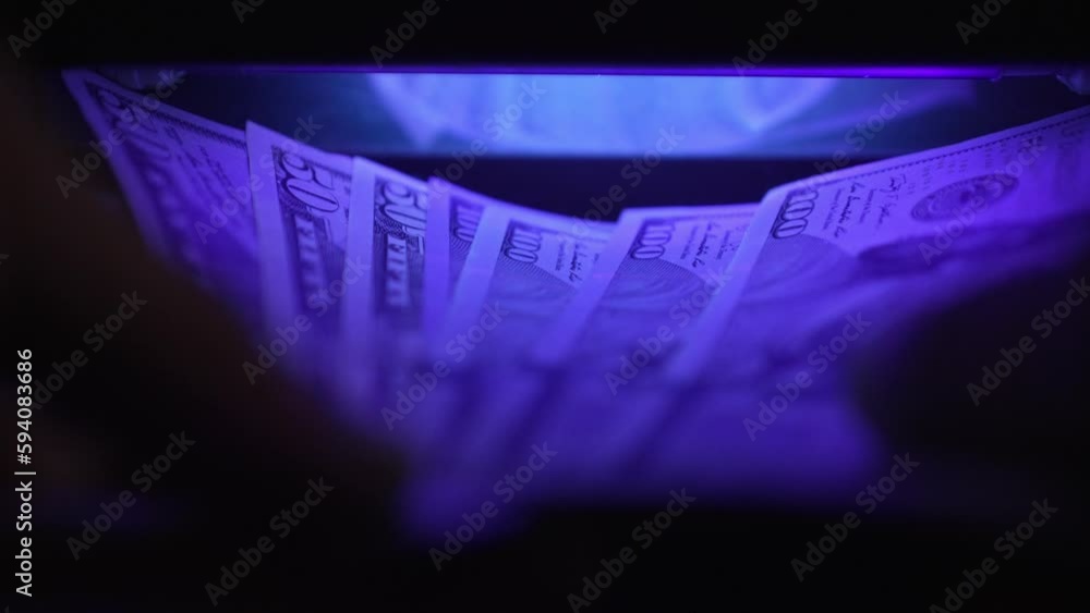 Soft focus on dollar banknote under ultraviolet light. Portrait of ...