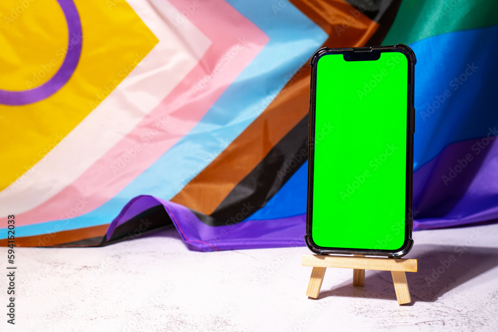 Fotka „Mobile phone with chroma key on Rainbow LGBTQIA flag made from ...