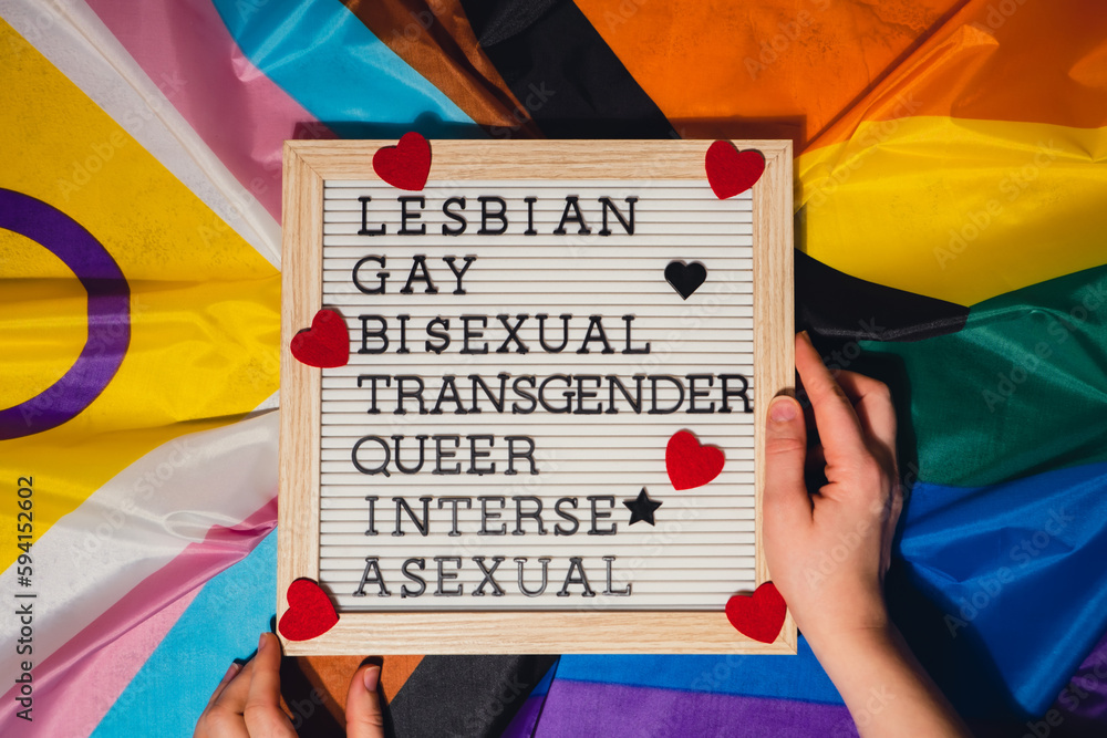 LGBTQIA description frame on Rainbow LGBTQIA flag made from silk ...