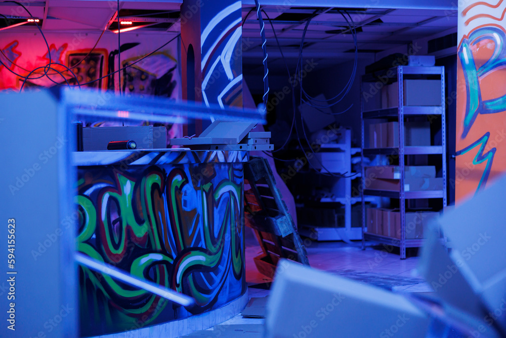 Chaotic illuminated empty space with dirty structure glowing with ...