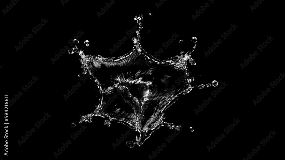 Super slow motion of splashing water isolated on black background ...