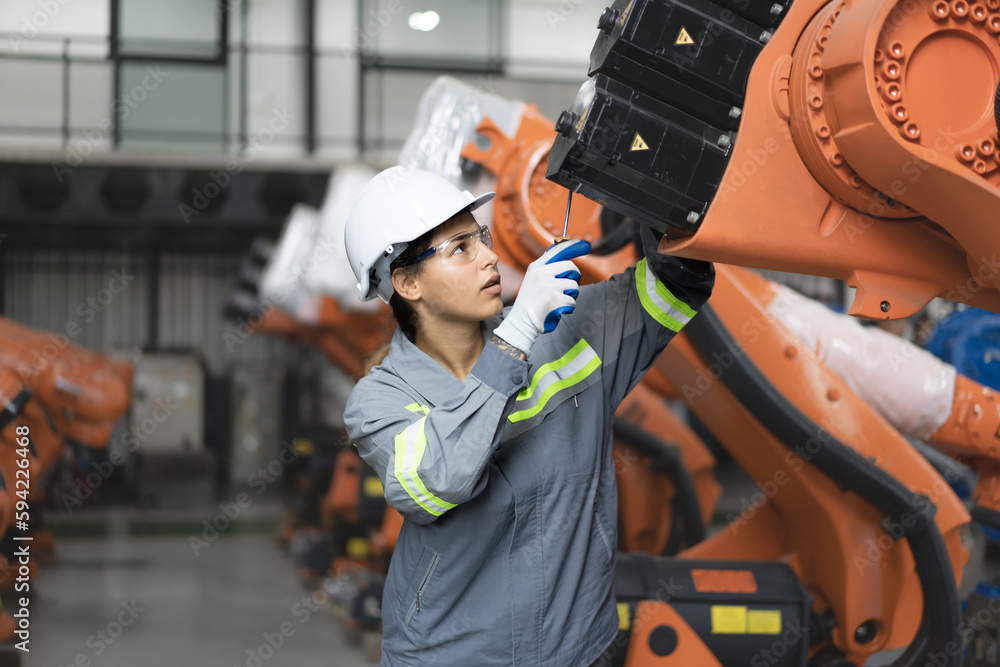Industrial engineer working on robot maintenance in AI futuristic ...