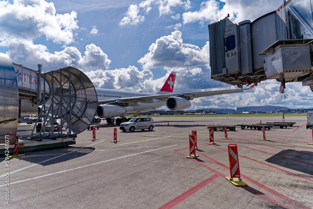 Tail and wing of Swiss Airbus A340-313 HB-JMA stationary at Swiss ...