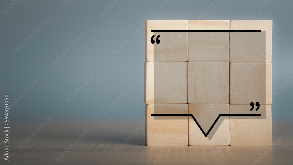 Quote box frame in wooden cube stack with copy space. Quotation text ...