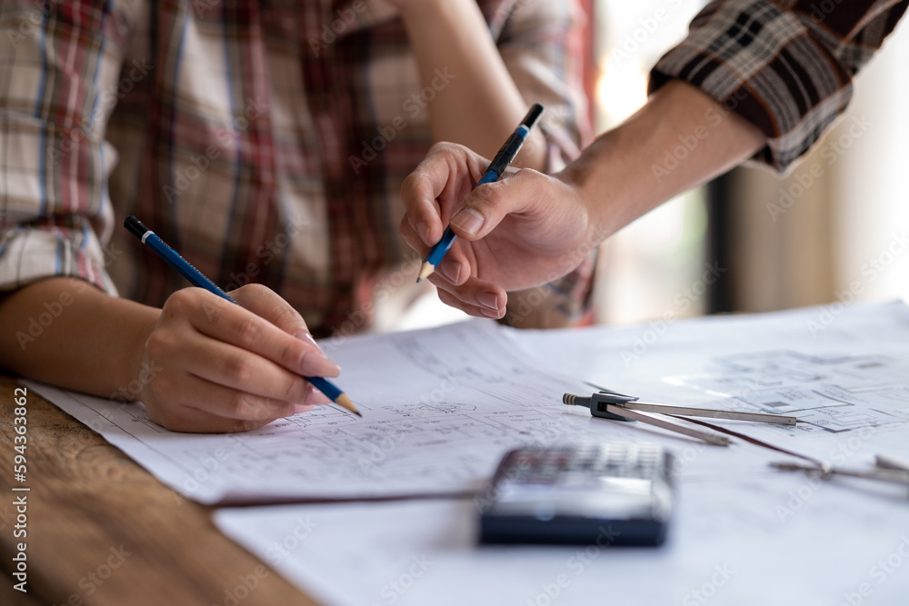 engineer are helping to design work on blueprints, engineer people ...