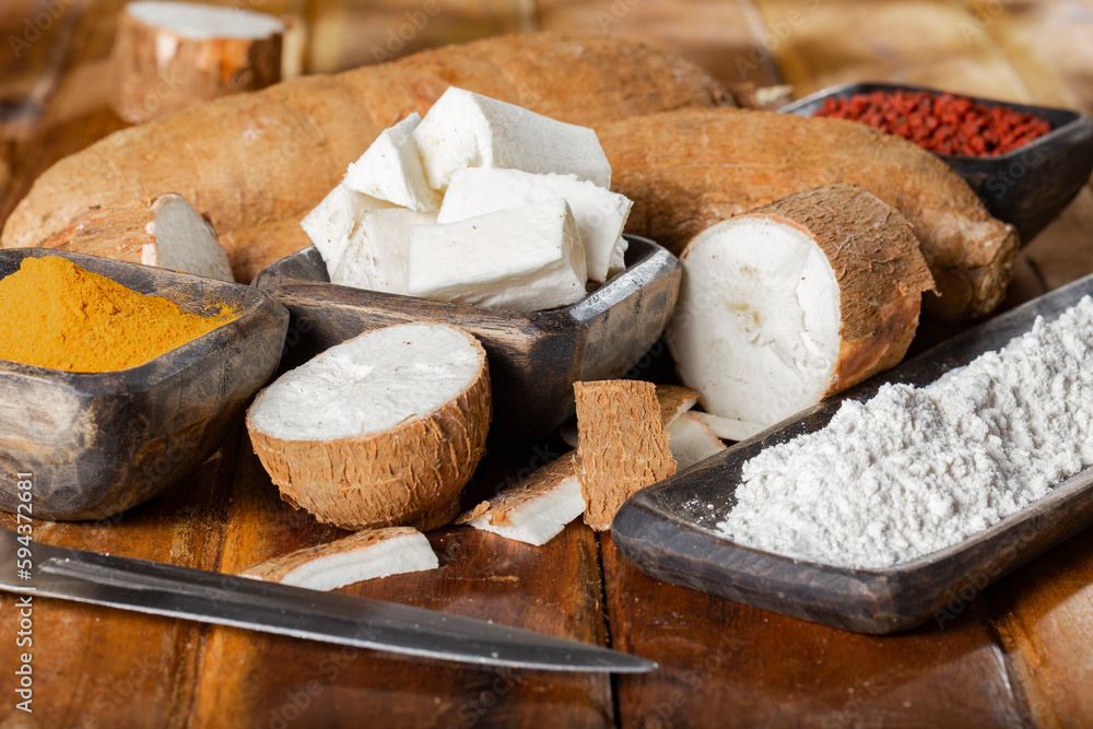 pile of cassava, cassava and cassava flour on a background of rustic ...