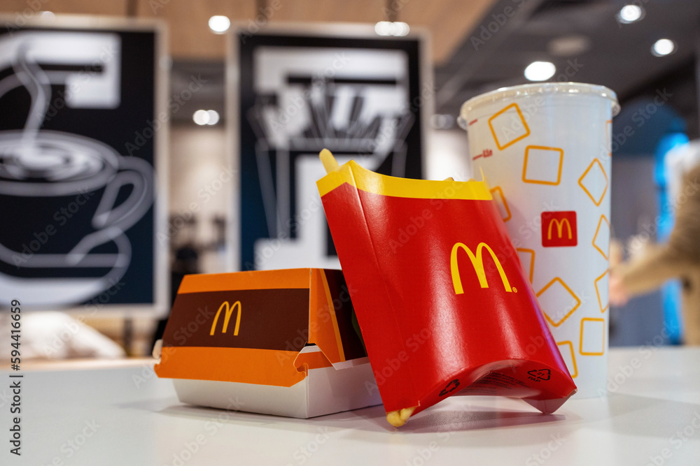 McDonald's logo in selective focus. McDonald's logos on a French fries ...