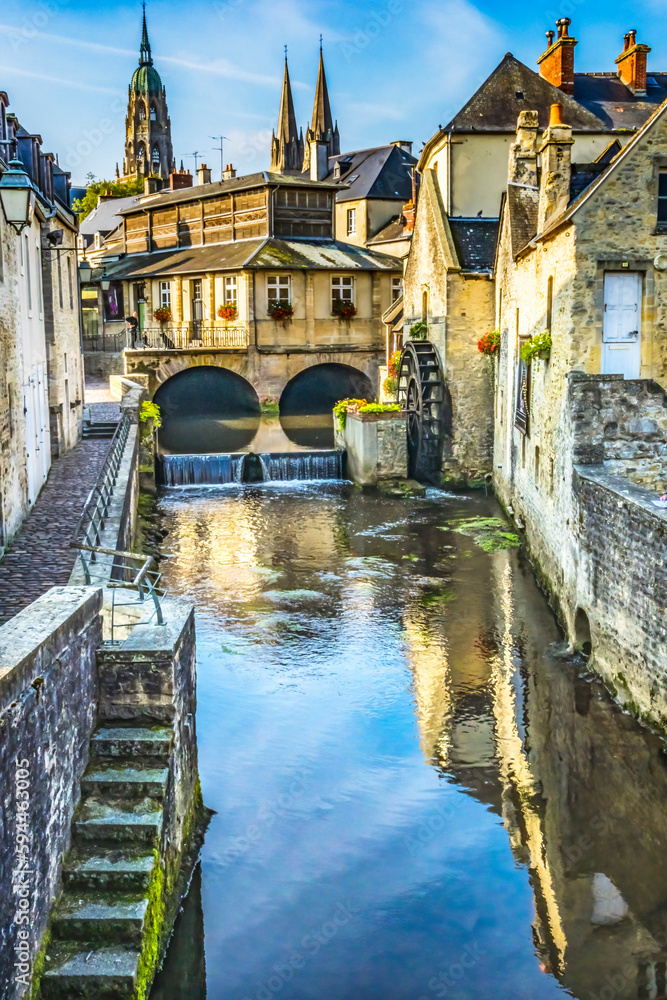 Colorful old buildings, Aure River reflection, Bayeux, Normandy, France ...