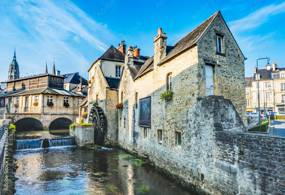 Colorful old buildings, Aure River reflection, Bayeux, Normandy, France ...