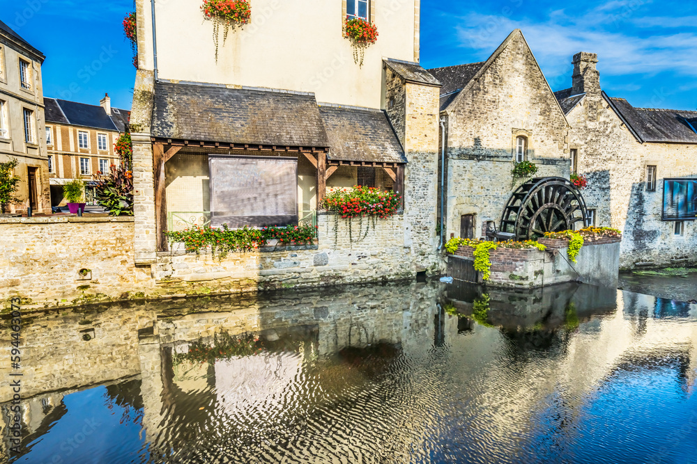Colorful old buildings, Aure River reflection, Bayeux, Normandy, France ...