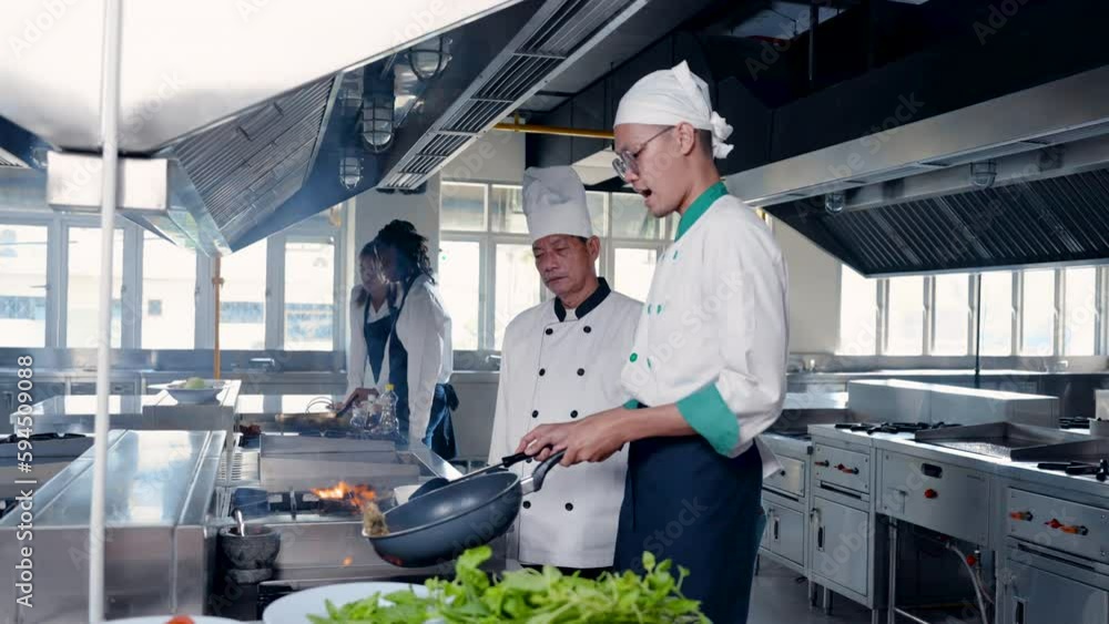 4K Slow, Fire in pan came out because chef stir-fried food in pan. with ...