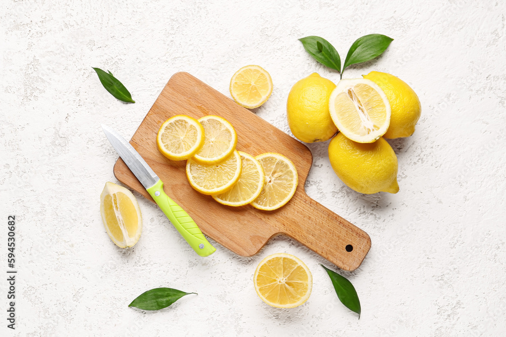 Board with fresh lemons on white background Stock Photo | Adobe Stock