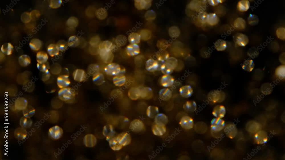 Video „Golden glitter background in slow motion. Beautiful transition with real gold particles ...