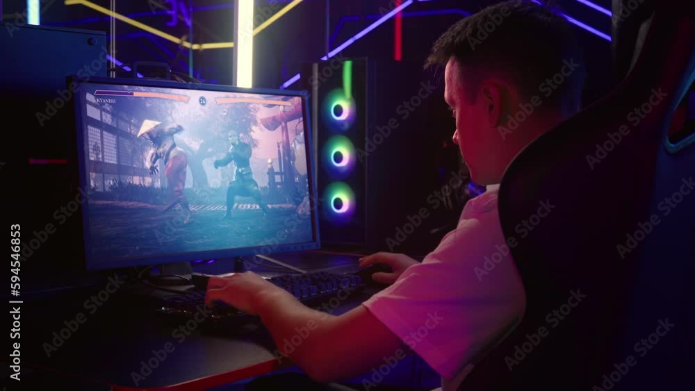 Player enjoying the newest fighting video game. Controlling the ...