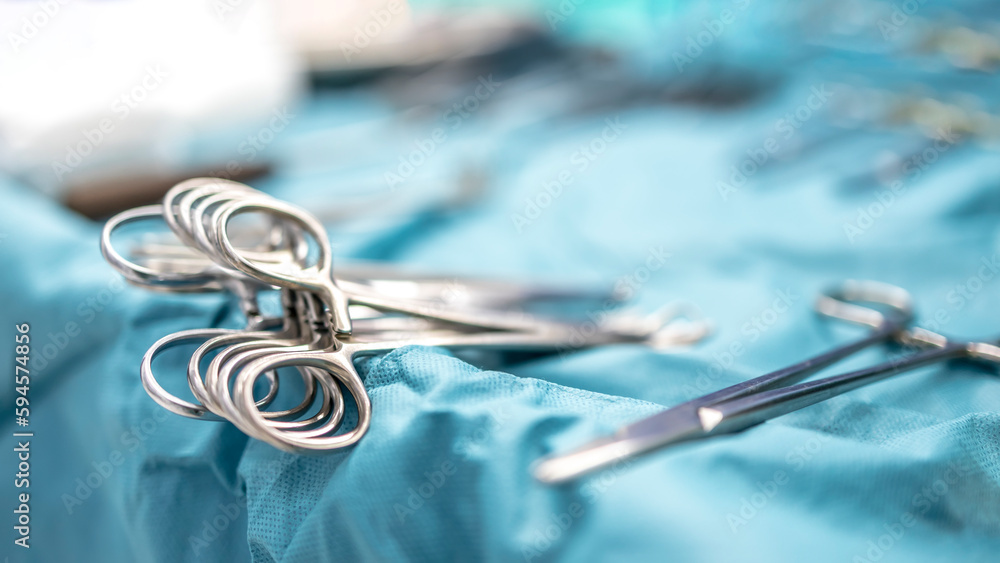 Surgical clamps and medical equipment on surgical tray.Surgical ...