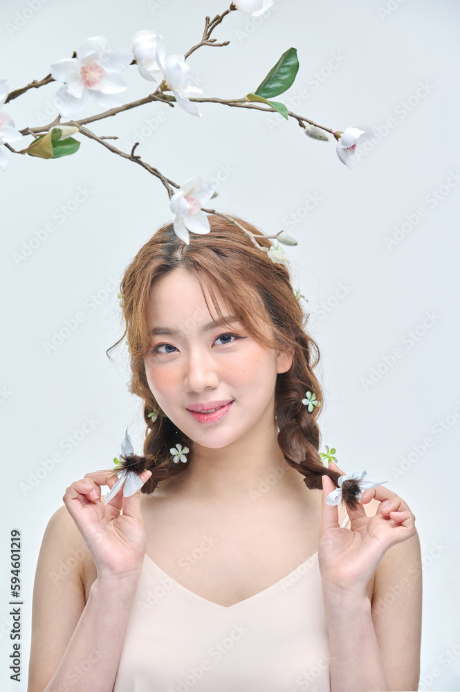 Beautiful Young Asian woman behind flower in beauty pose. Pretty girl ...