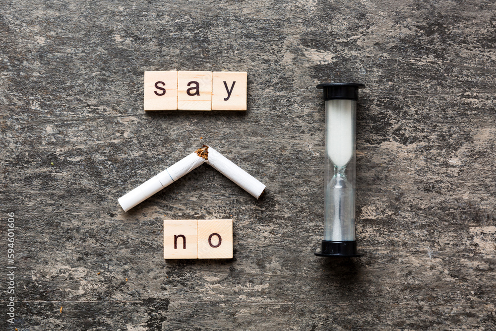 Cigarette And Wooden Blocks, Broken cigarette on table background with ...
