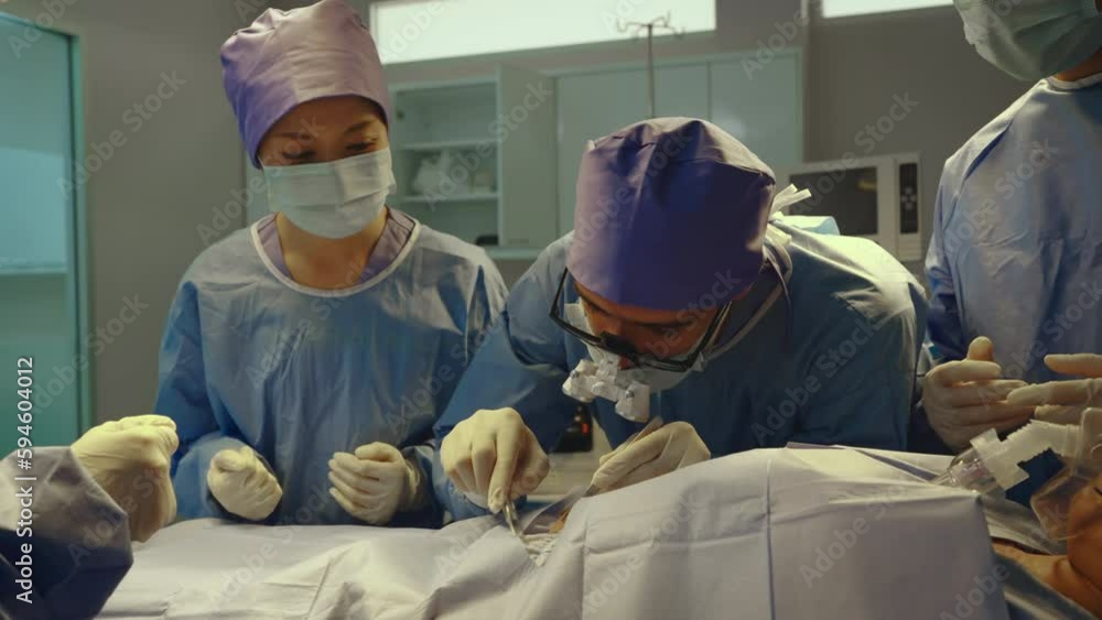 Doctor using tools at operation room. doctor took knife down cut chest ...