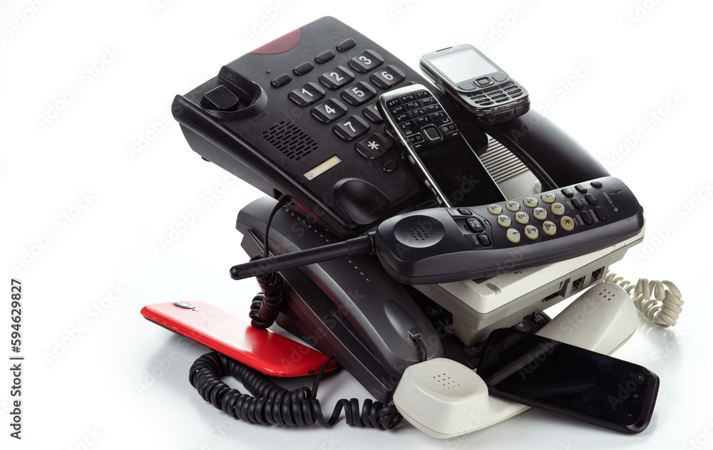 Pile of old desk phones, cordless phone, and smartphones on a white background Stock Photo ...