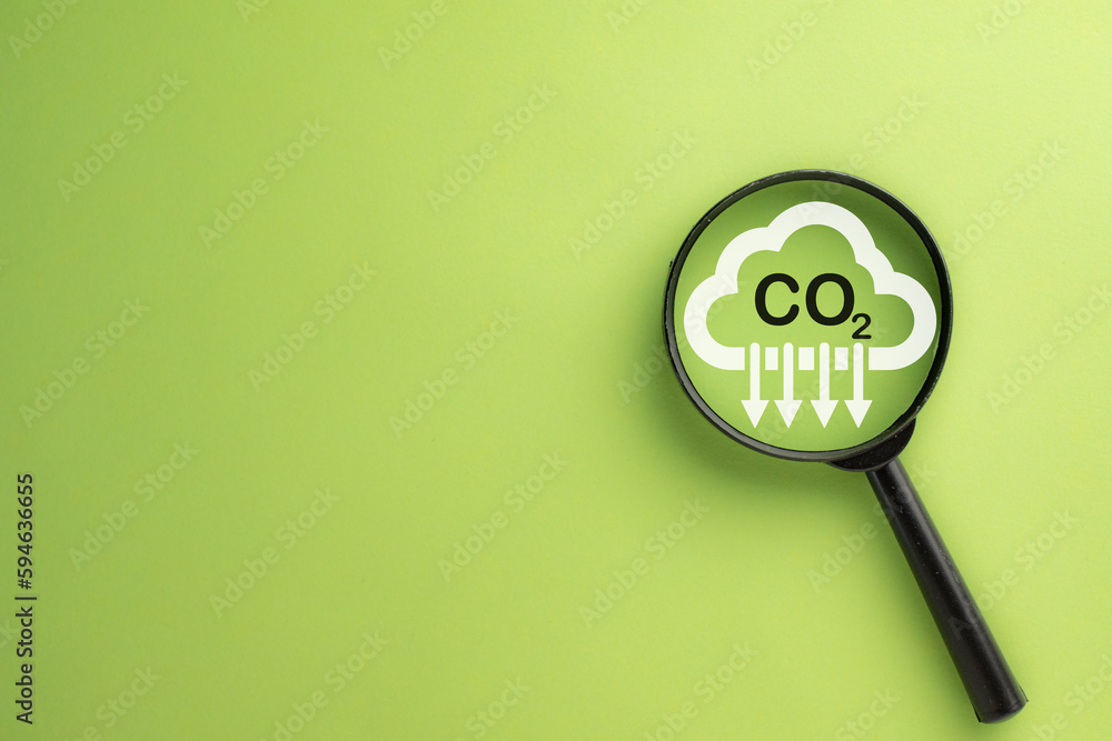Reduce Co2,Carbon Reduction,Carbon dioxide emissions, carbon footprint concept.,Magnifying glass ...