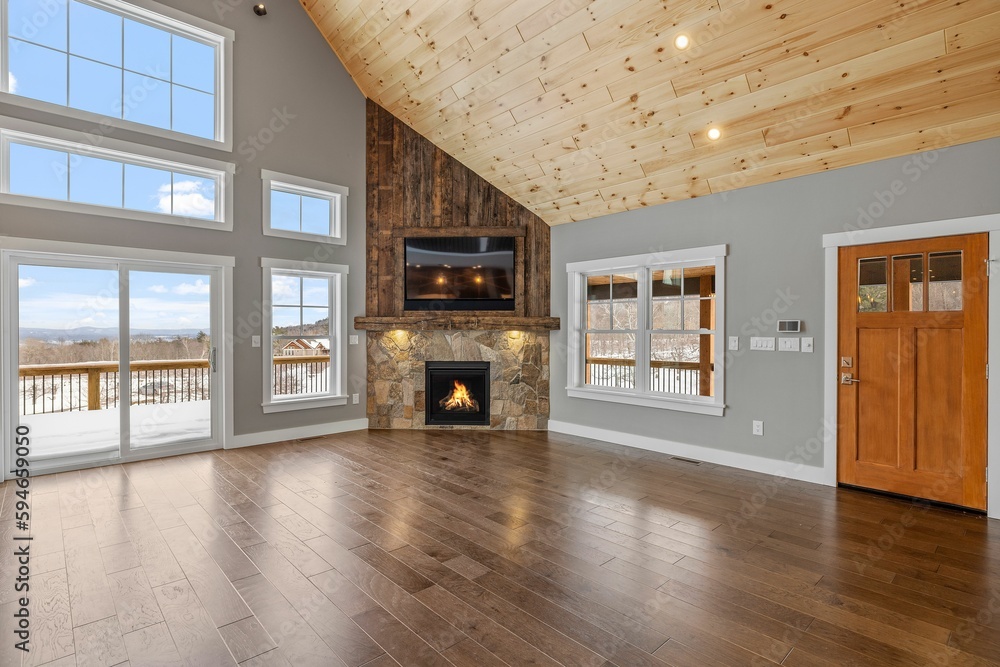 Stunning room with elegant wood flooring and large windows Stock Photo ...