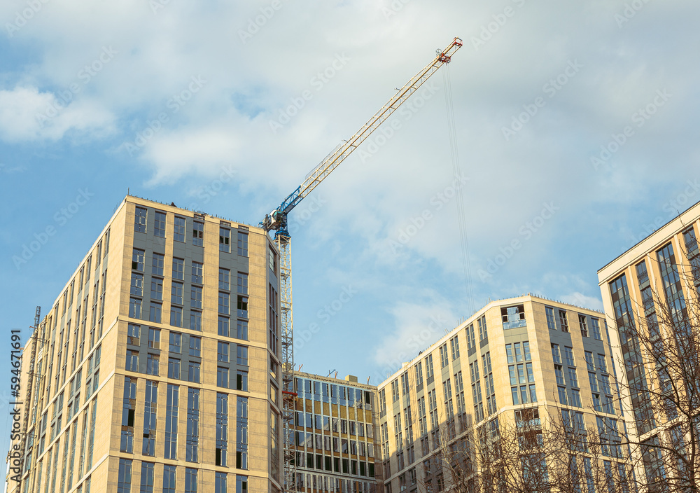 Construction site. Construction cranes and a building under ...