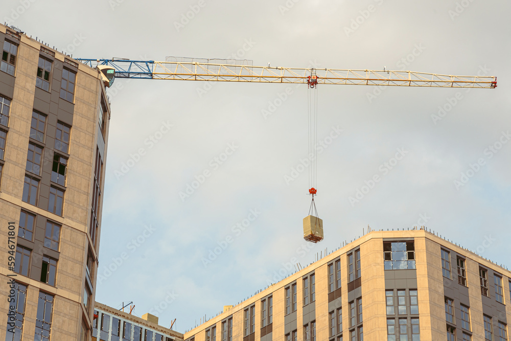 Construction site. Construction cranes and a building under ...
