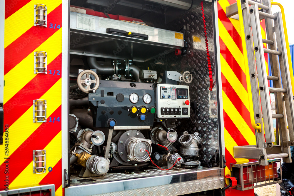 Water and foam pump engine in red fire truck. Fire truck rear view ...