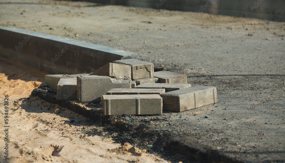 The process of building and repairing a sidewalk paved with brick, a ...