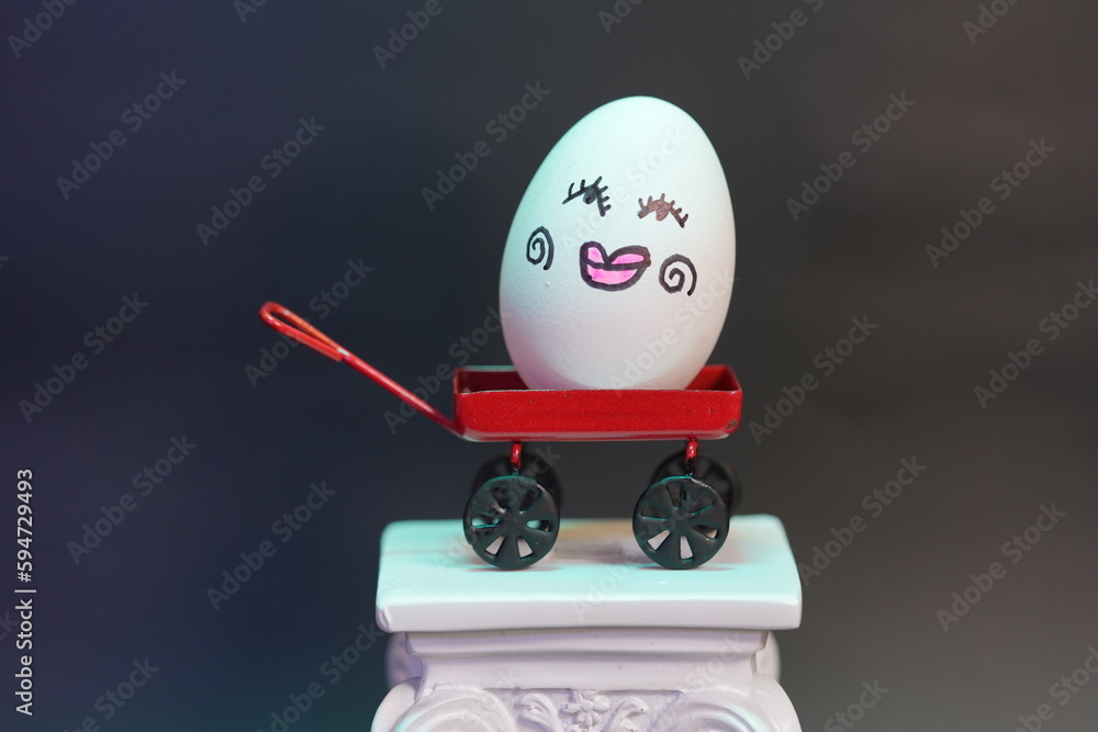 Animated egg with drawings of different faces and expressions mounted ...