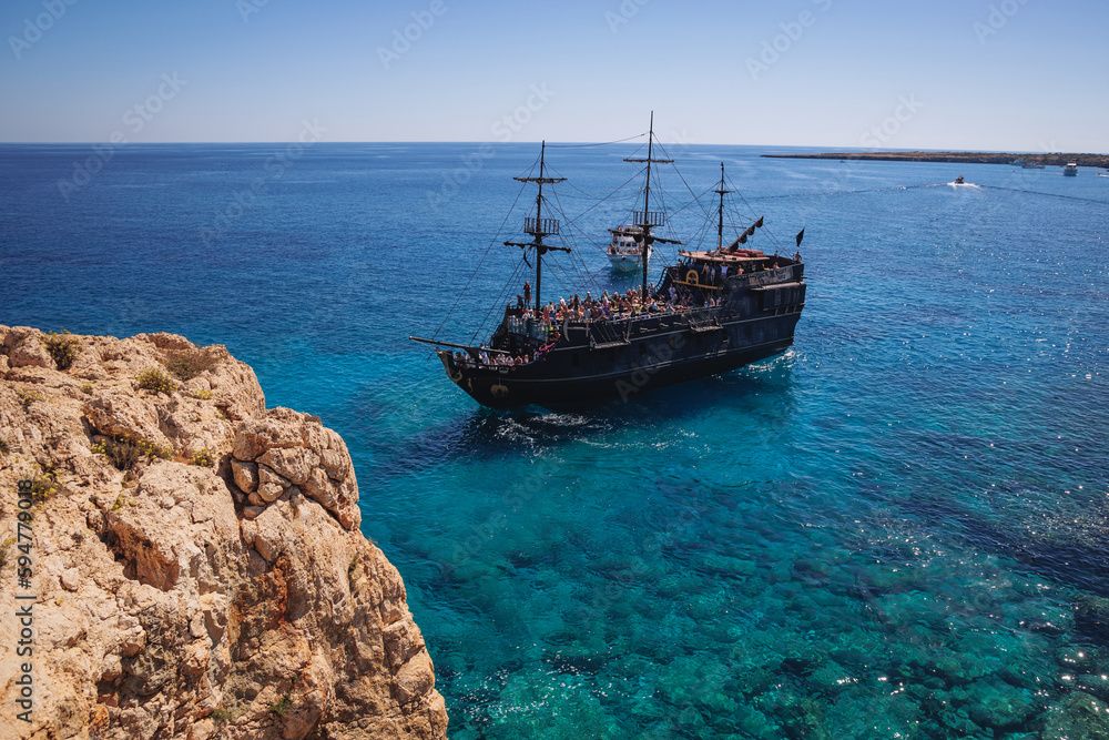 Pirate ship for tourists next to Kamara tou Koraka stone arch in Cape ...