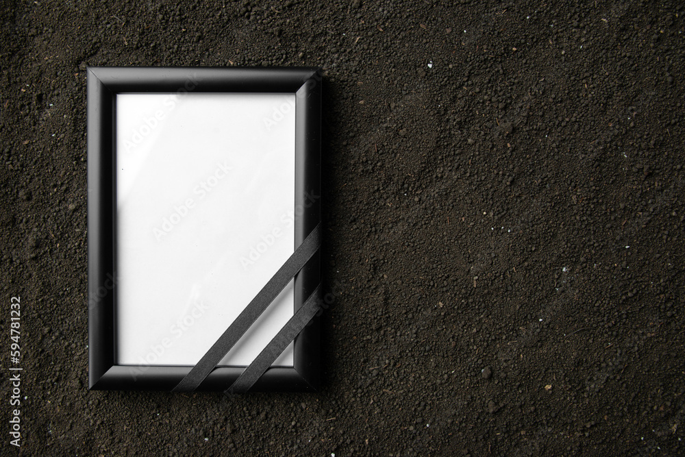 top view of picture frame on dark soil grim reaper death portrait photo ...