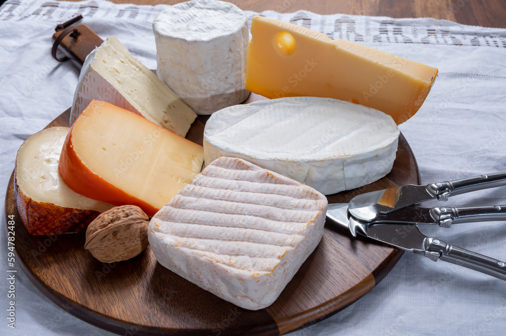 Collection of Belgian cheeses, soft yellow cow milk cheese with white ...