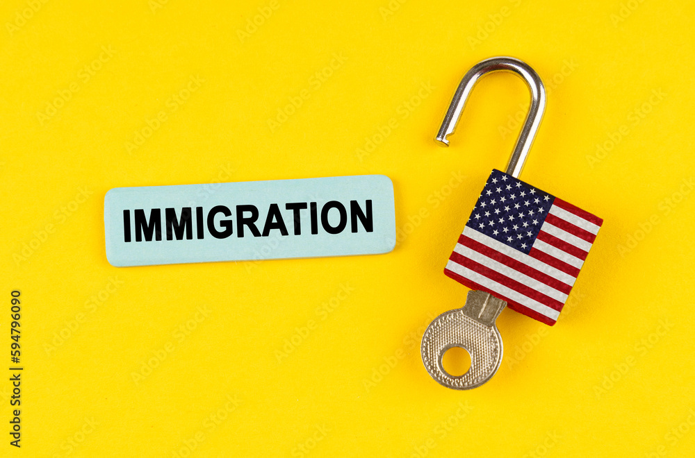 Foto de On the yellow surface is an open lock with a key and a sticker ...