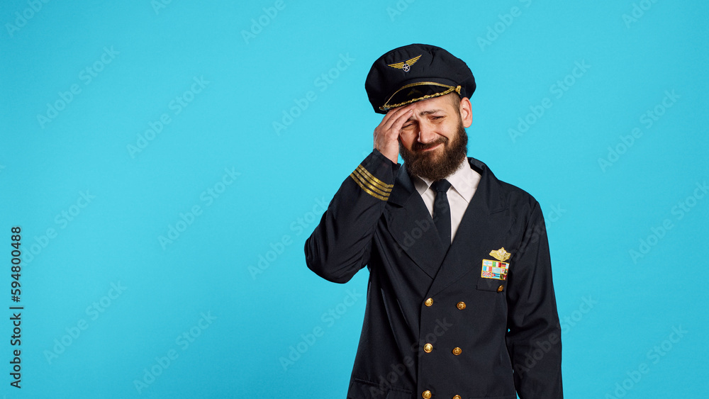 Sick airplane pilot suffering from headache, being worried about ...