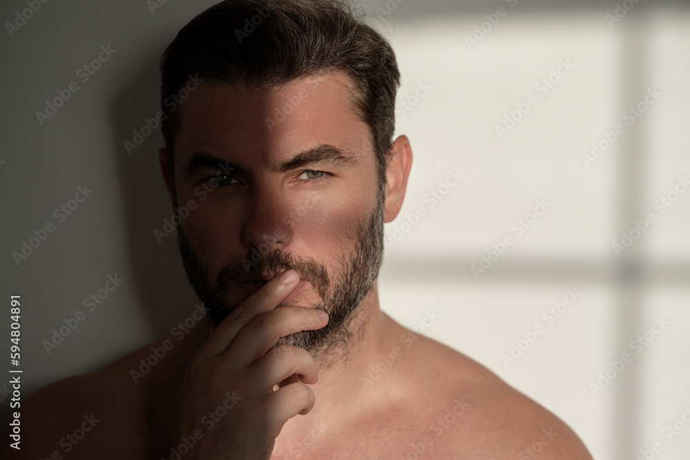 Closeup beauty portrait of satisfied young man after facial cream ...