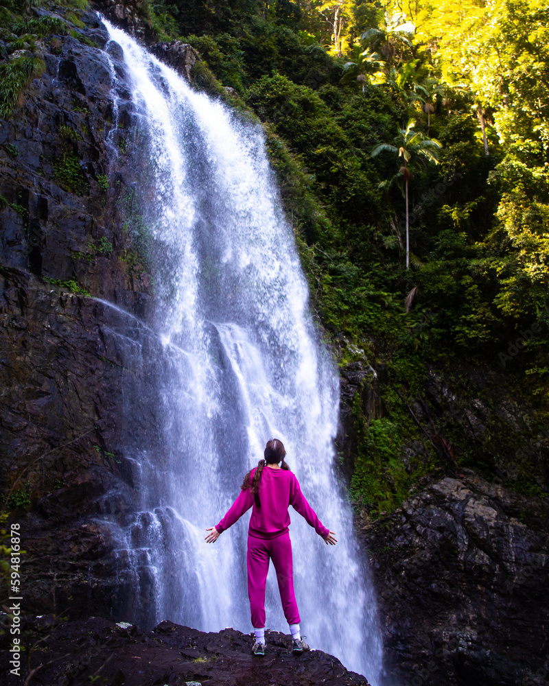 close up on a beautiful, brave, long haired girl standing in front of a ...