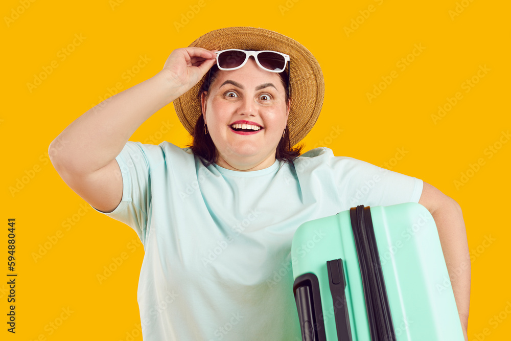 Portrait of happy surprised smiling fat woman in straw hat holding ...