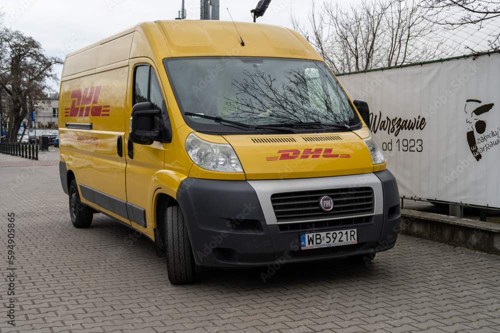 DHL delivery truck delivers packages. Logistics shipping company yellow ...
