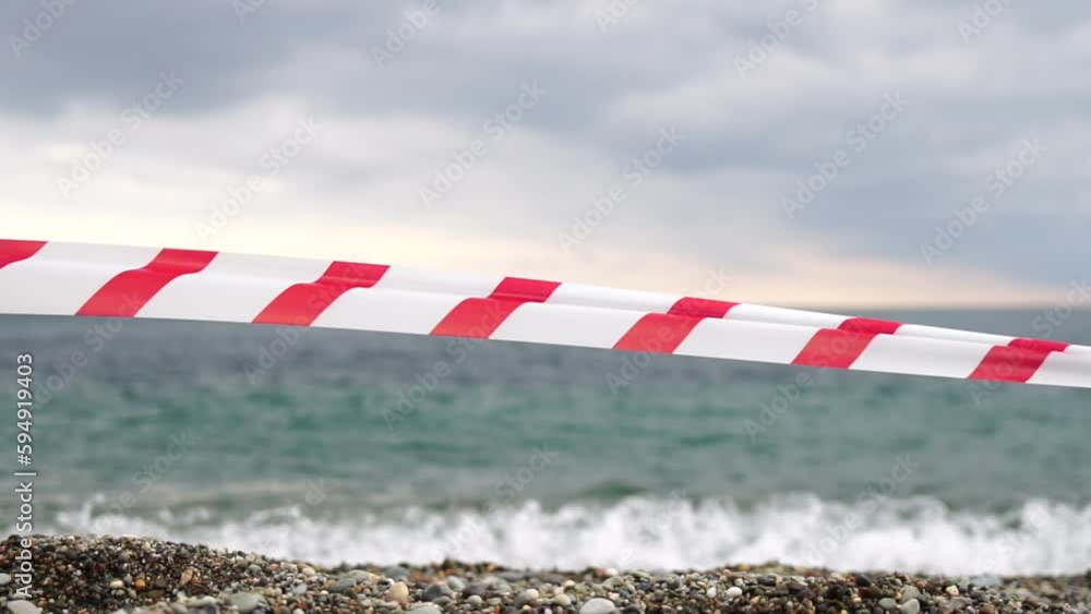 Vidéo Stock Red white warning tape barrier ribbon swinging in the wind ...