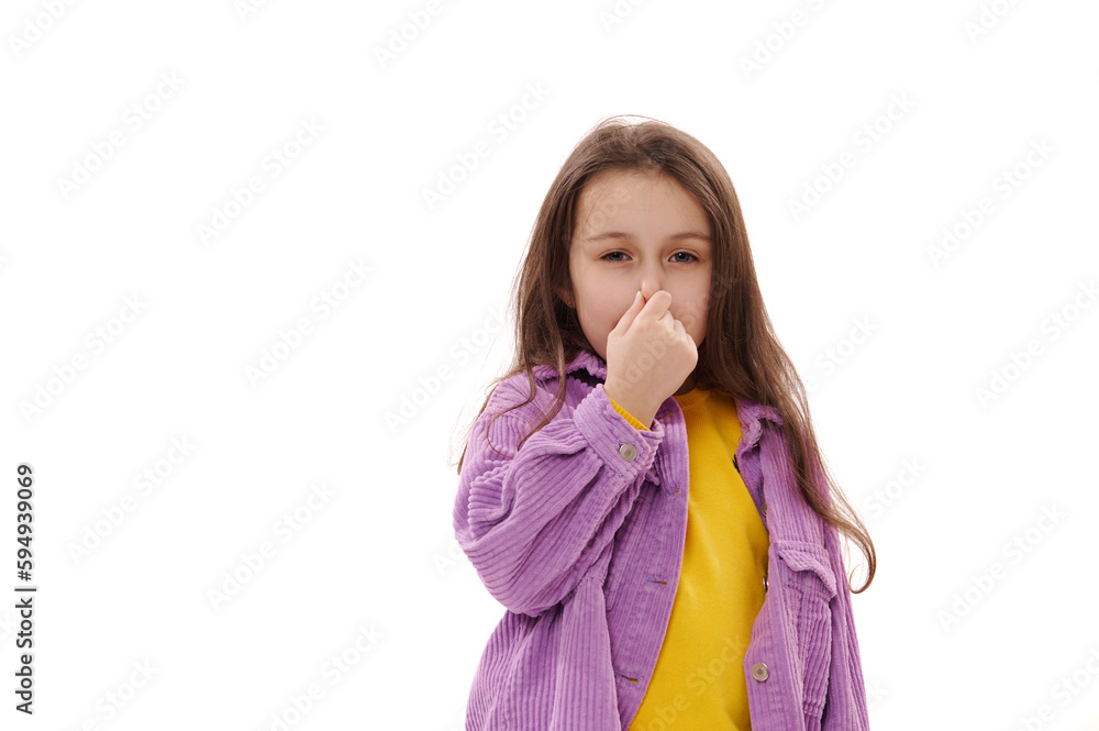 Cute Caucasian child girl is closing her nose with her hand,because of ...