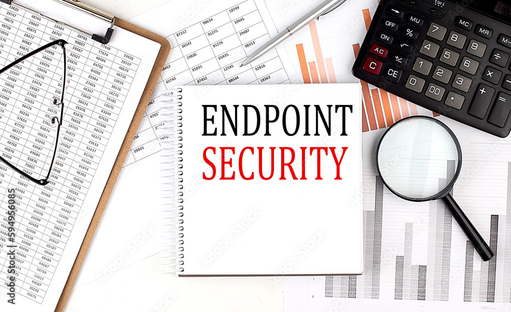 ENDPOINT SECURITY text on notebook with clipboard and calculator on a ...