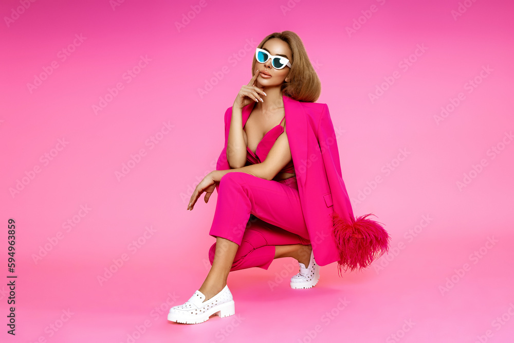 High fashion model. Elegant woman is wearing pink feather jacket ...