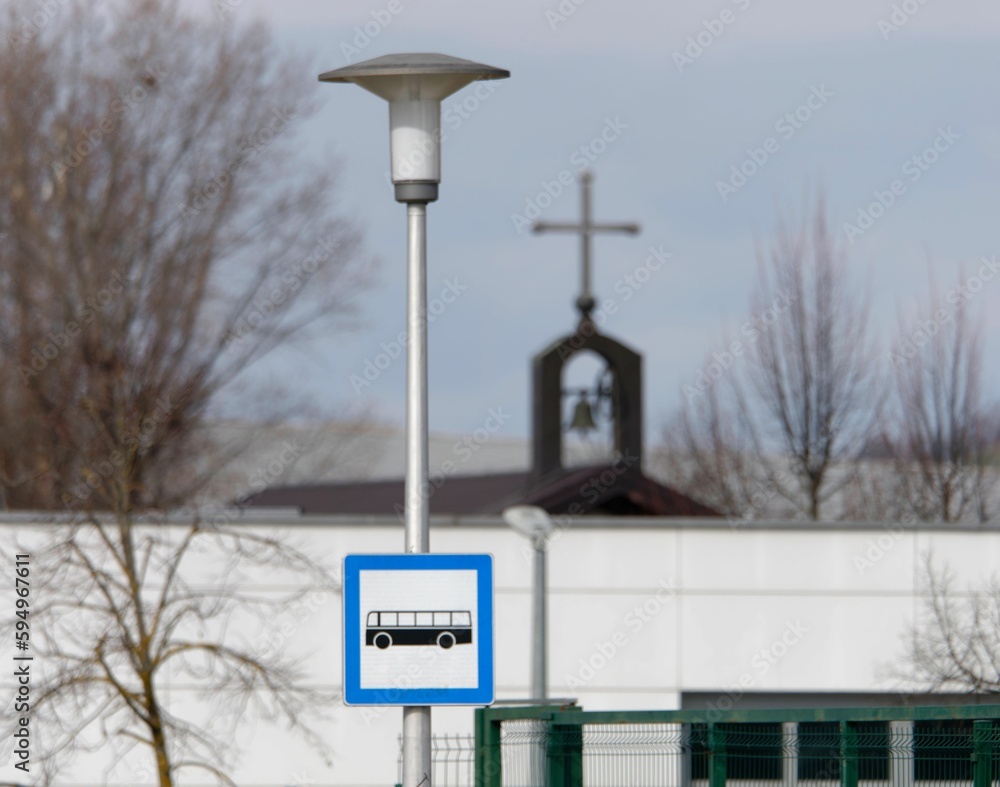 Bus stop sign located in front of the entrance of an old building Stock ...